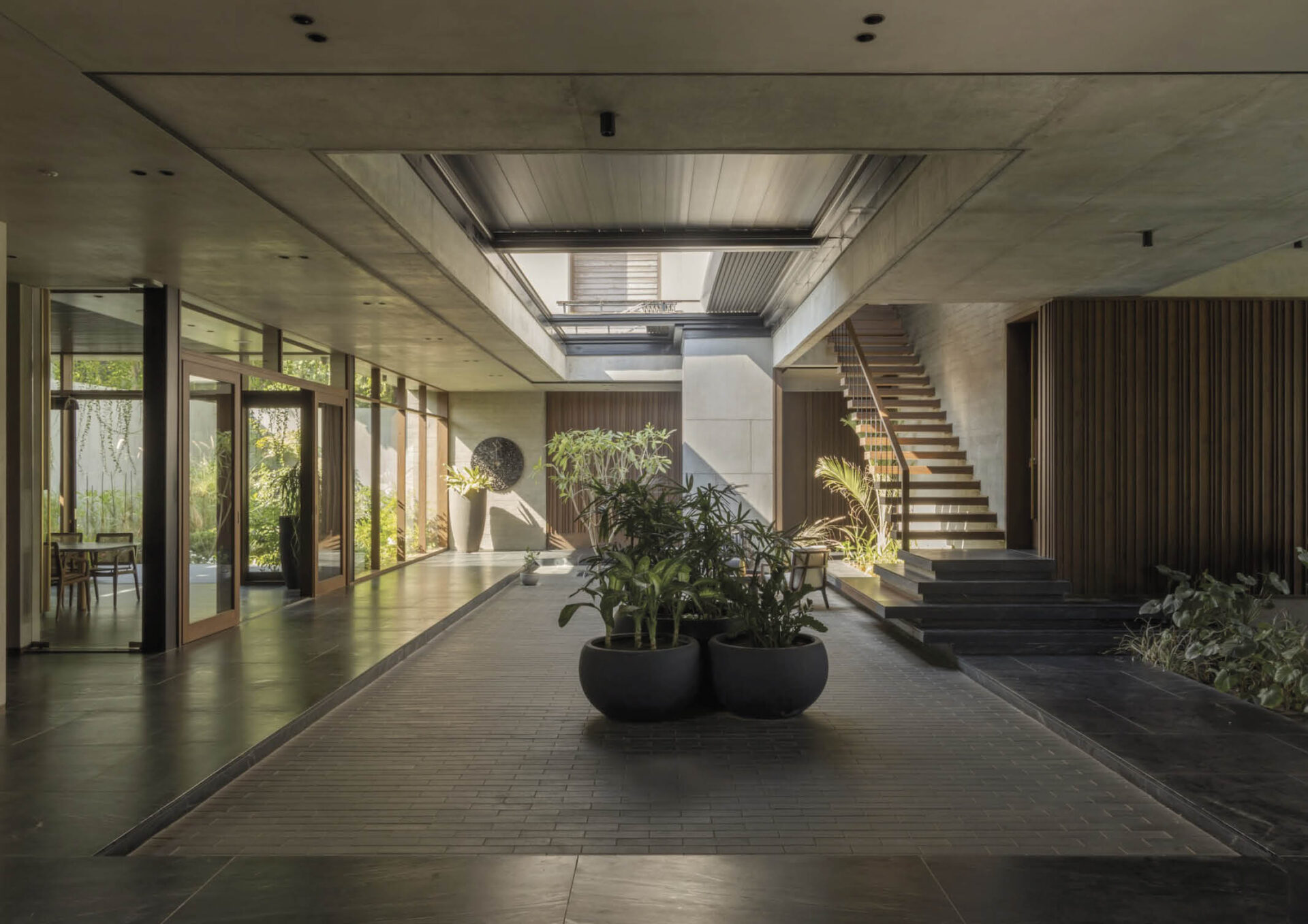 Courtyard House Invites Nature Through Open Spaces